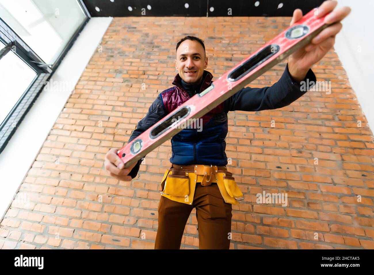 Builder handyman with construction tools. House renovation background ...