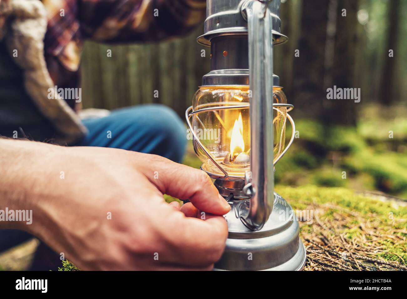 Hiker using a Gasoline lantern in the forest Stock Photo - Alamy