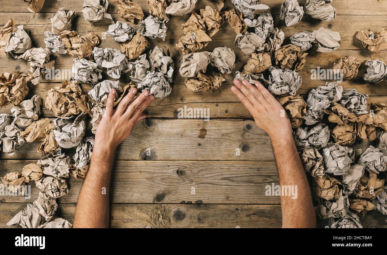 hands push away crumpled paper balls, copyspace for your individual ...
