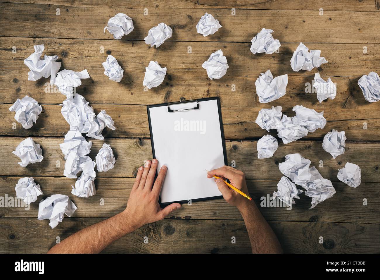 Hands holding clipboard and write Mock-up or ideas with crumpled paper ...