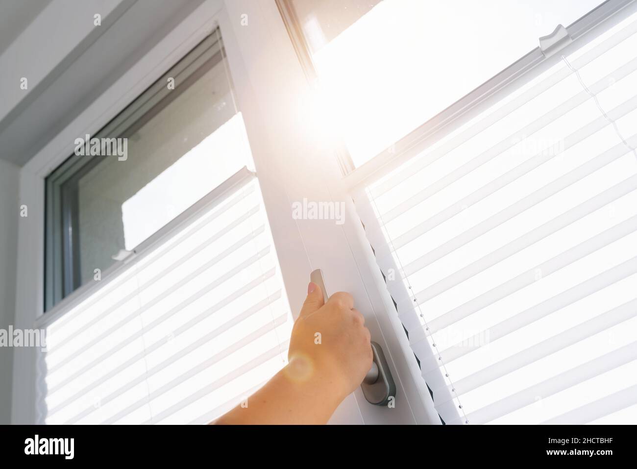 hand open plastic window with roller Stock Photo - Alamy