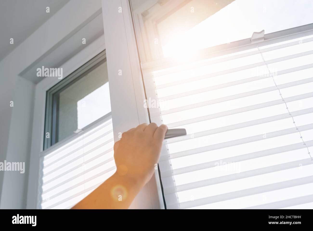 woman hand opens a pvc window with roller Stock Photo - Alamy