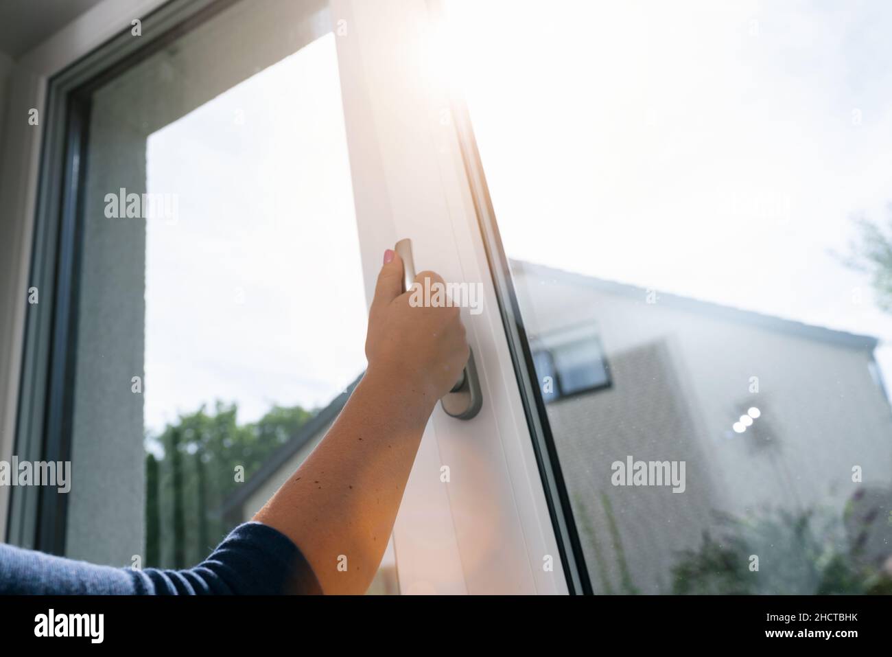 Arm open white plastic window with sunlight Stock Photo - Alamy