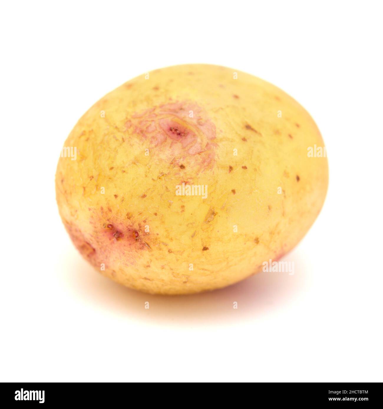 Small new potatoes with pink coloration isolated on white background ...
