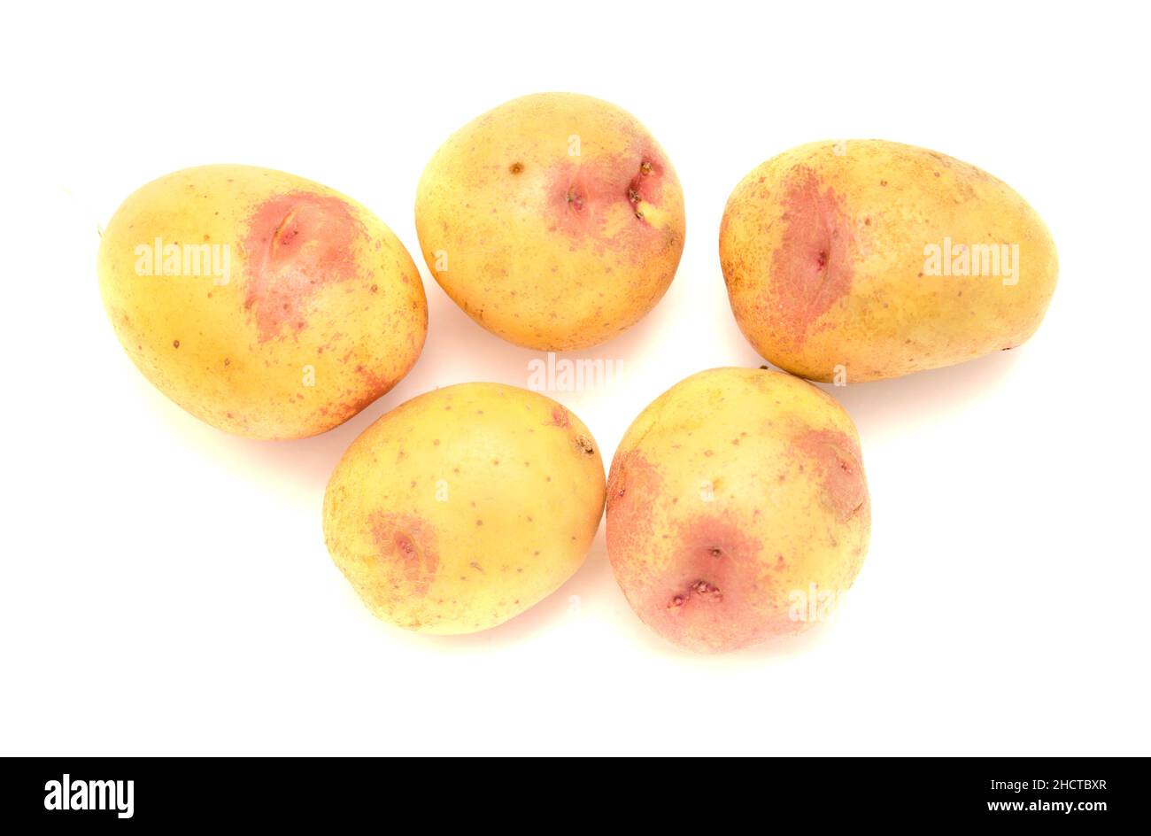 Small new potatoes with pink coloration isolated on white background ...