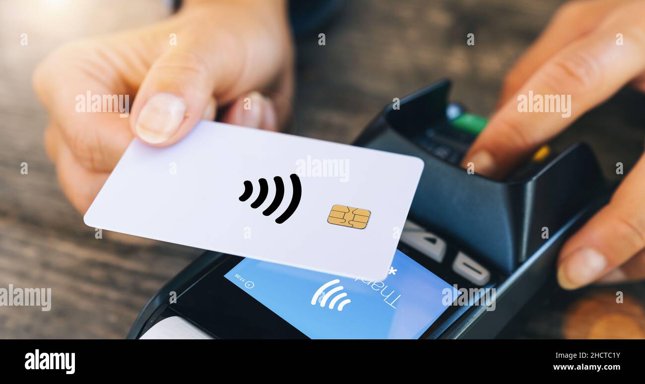 Contactless payment concept, female customer holding credit card near ...
