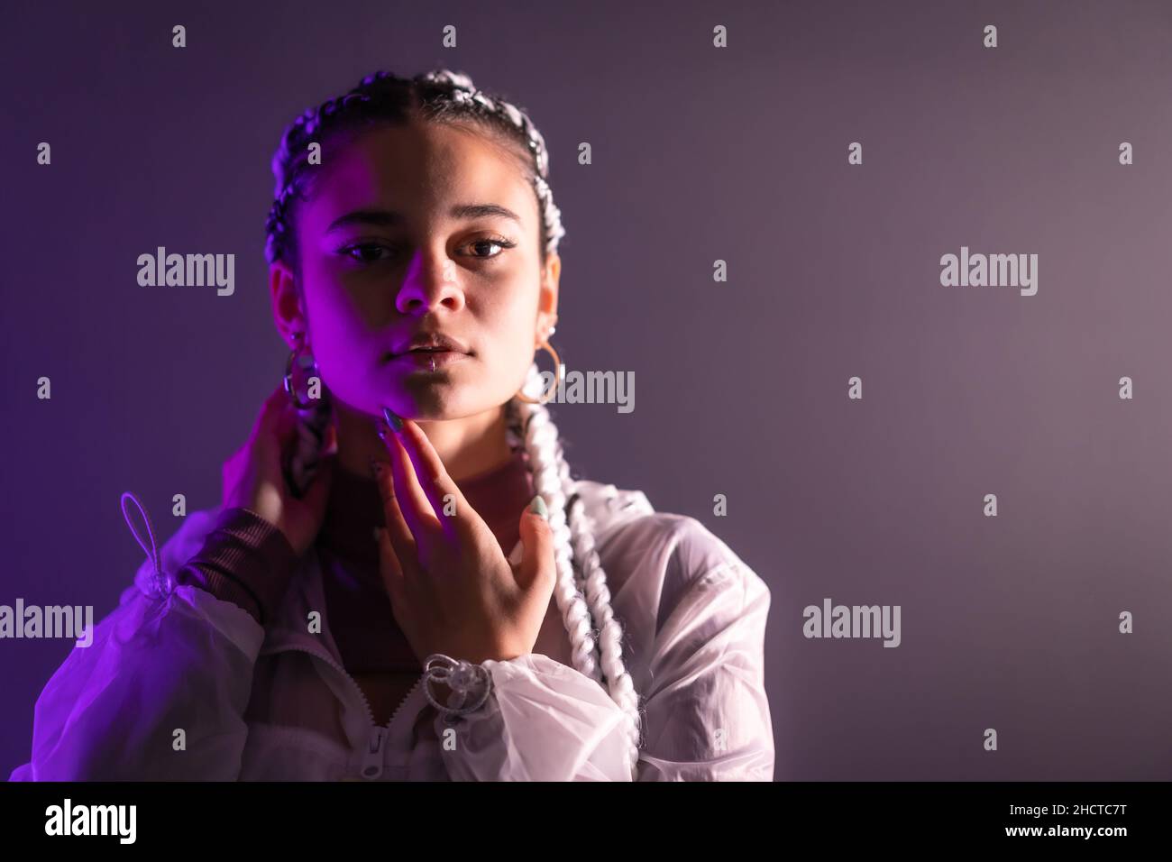 Urban session. Portrait of a young Caucasian woman with long white ...