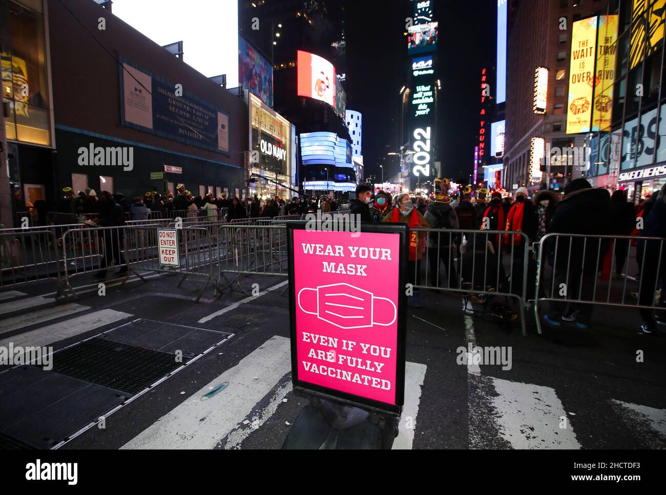 New York, USA. 31st Dec, 2021. A sign of wearing mask is set up during ...