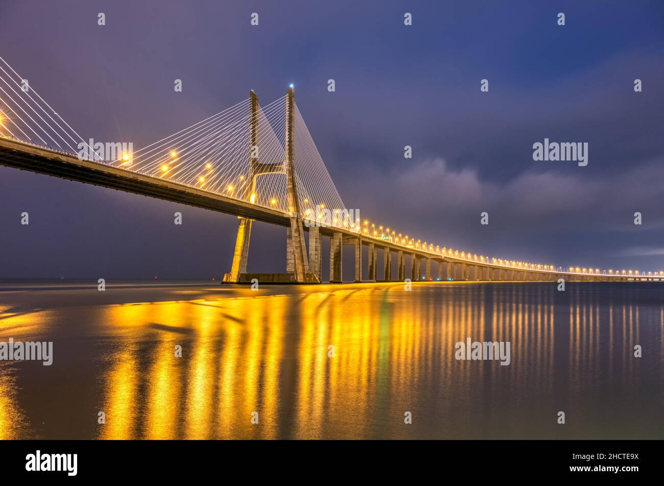 The famous cable-stayed Vasco da Gama bridge across the river Tagus in Lisbon, Portugal, at ...