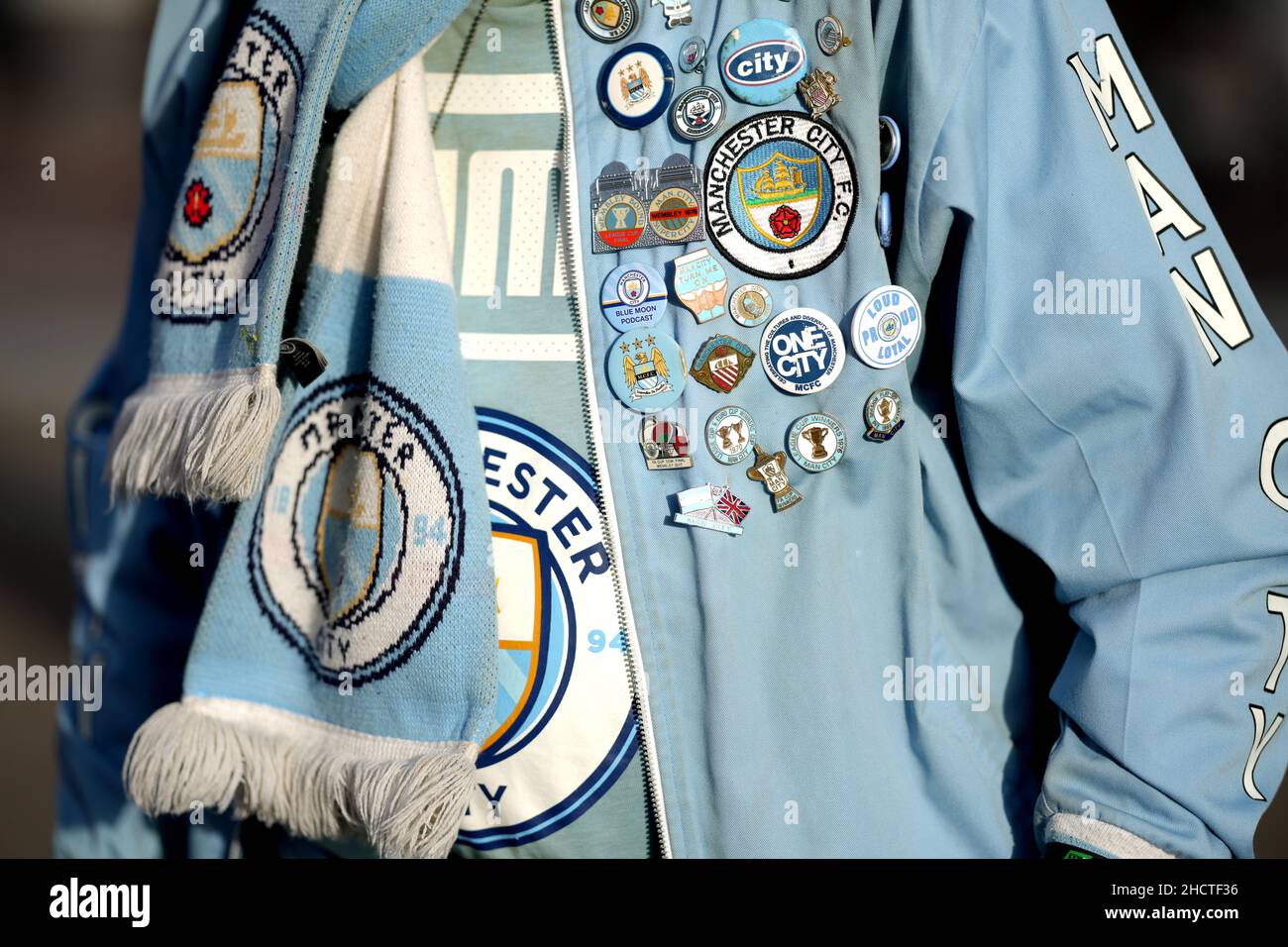 A view of Manchester City pin badges on the jacket of super fan 'Pete ...