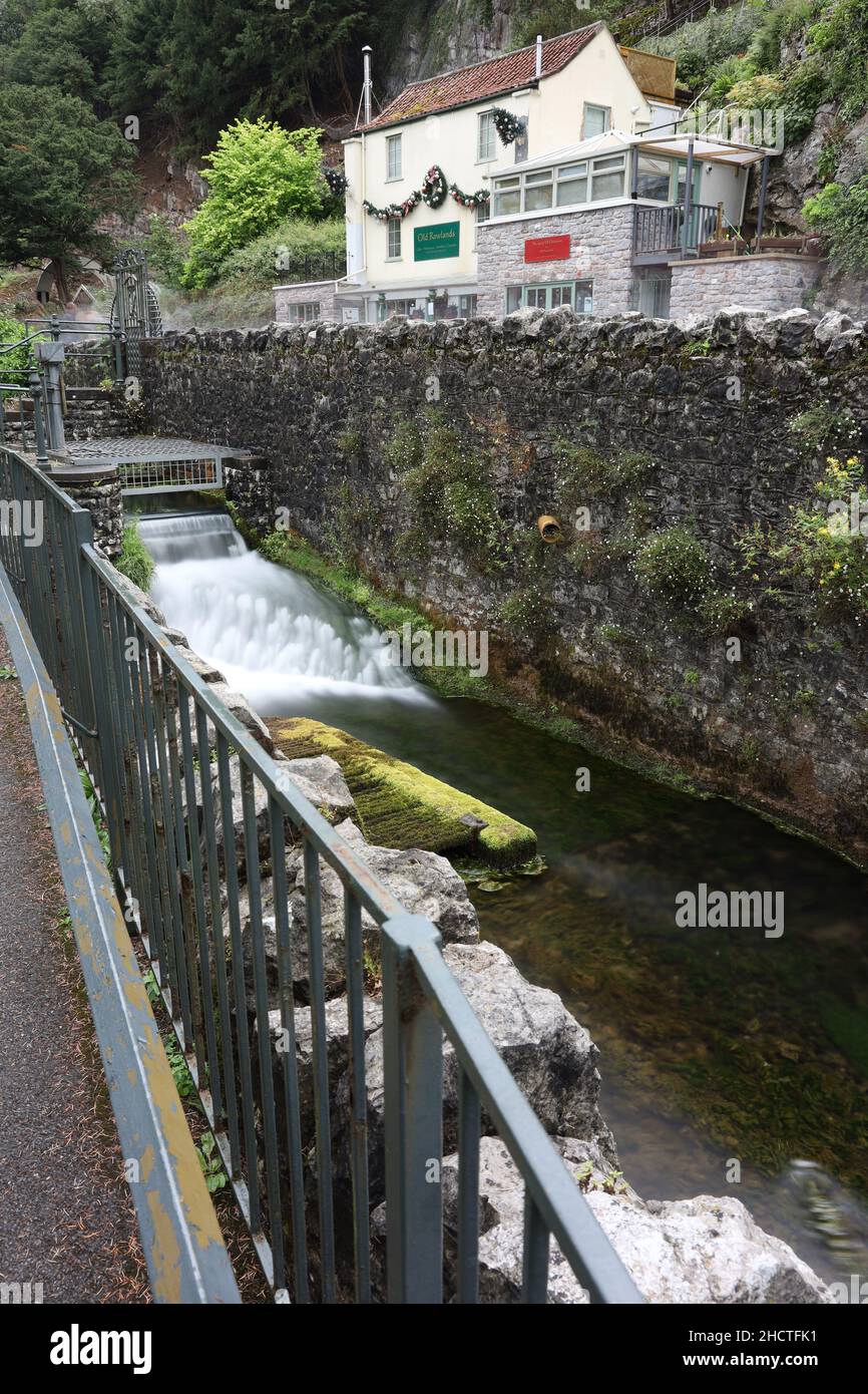 View of Cheddar Gorge bridge on a stream long exposure movement blurred ...