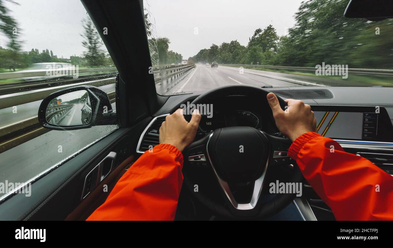 Driving car at a rainy day on a highway - POV, first person view shot ...