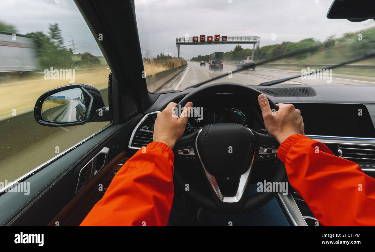 Driving car at a rainy day on a highway - POV, first person view shot ...