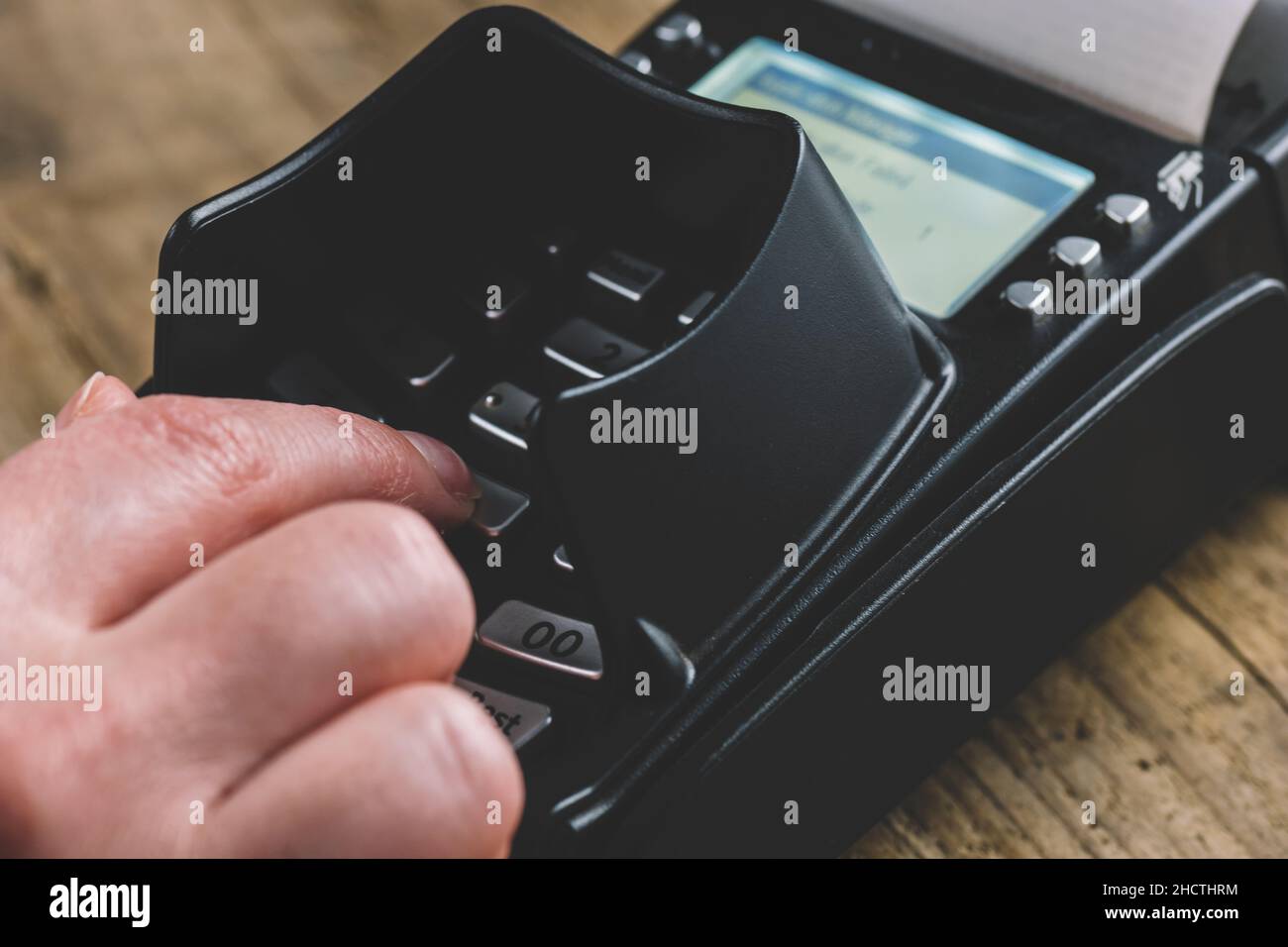 Man hand typing his PIN password at store checkout in card reader Stock ...