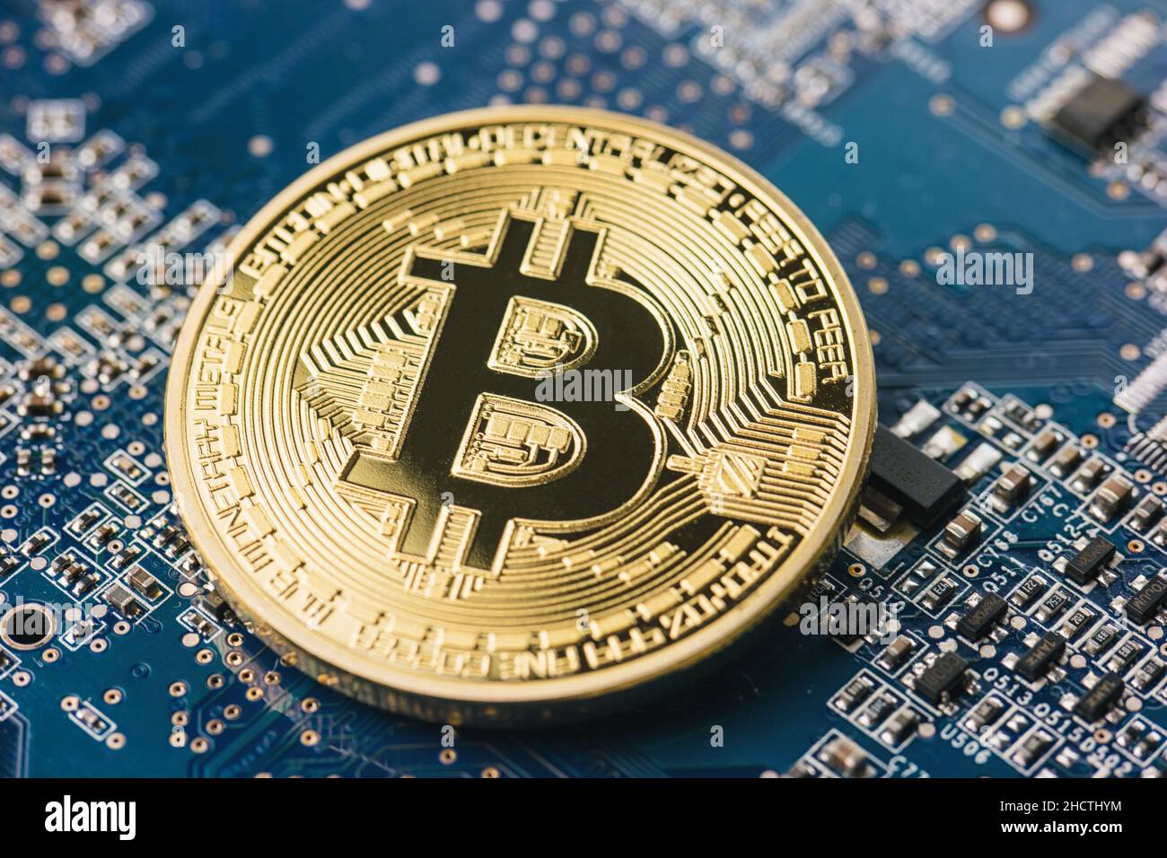 Golden bitcoin on mainboard surface Stock Photo - Alamy