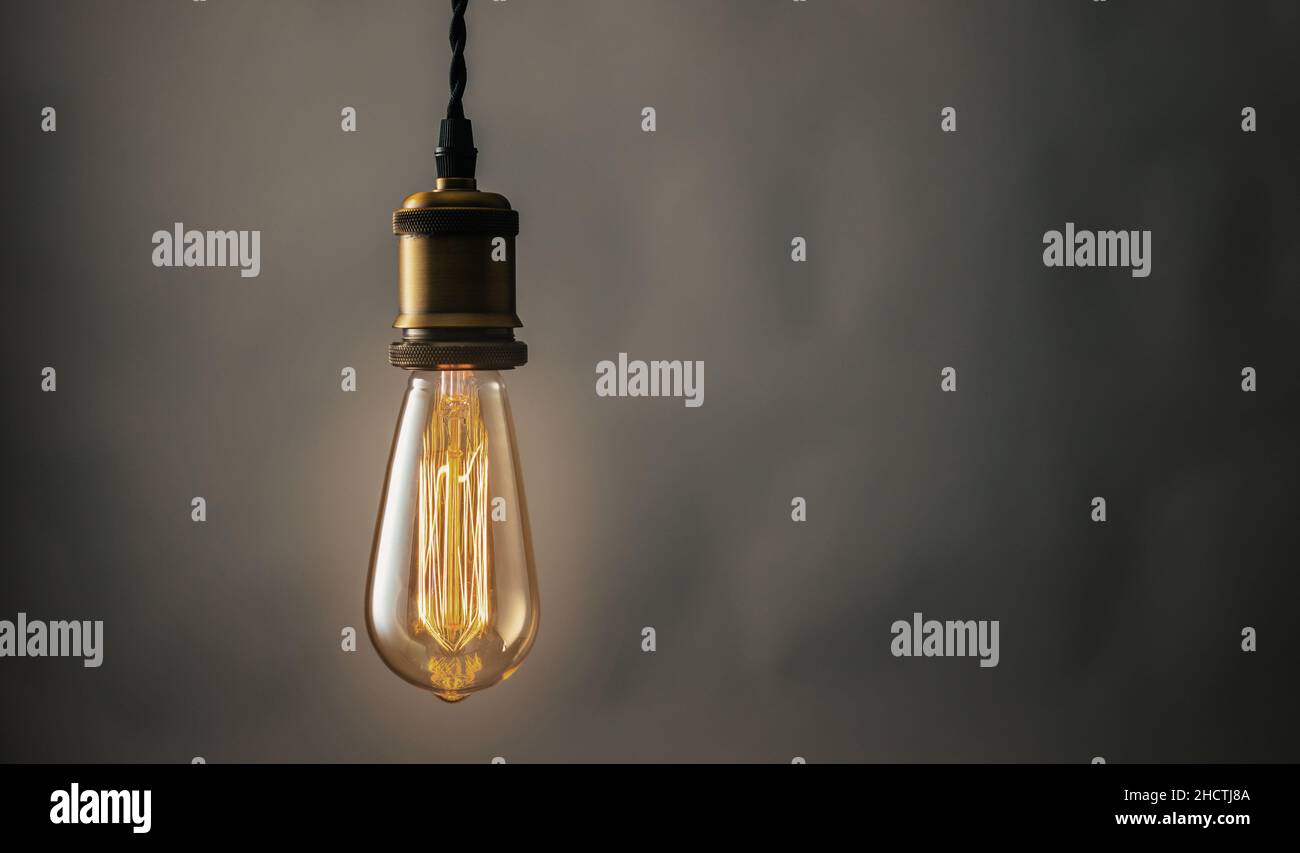 illuminated vintage hanging Edison light bulb Stock Photo - Alamy