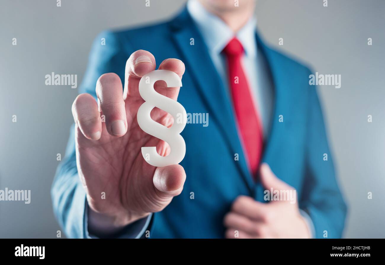 lawyer holding paragraph sign - law concept image Stock Photo - Alamy