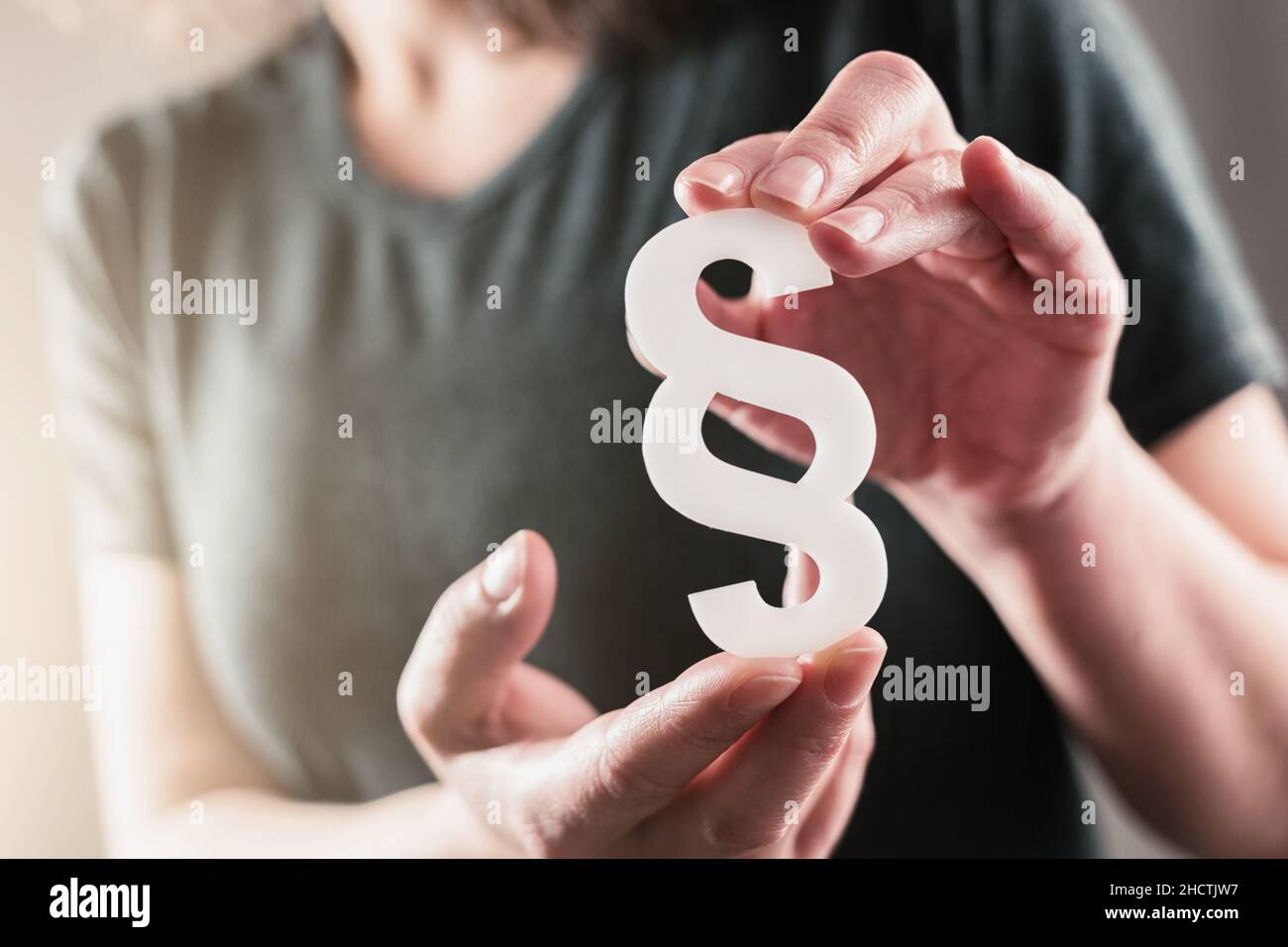 woman presents a paragraph sign Stock Photo - Alamy