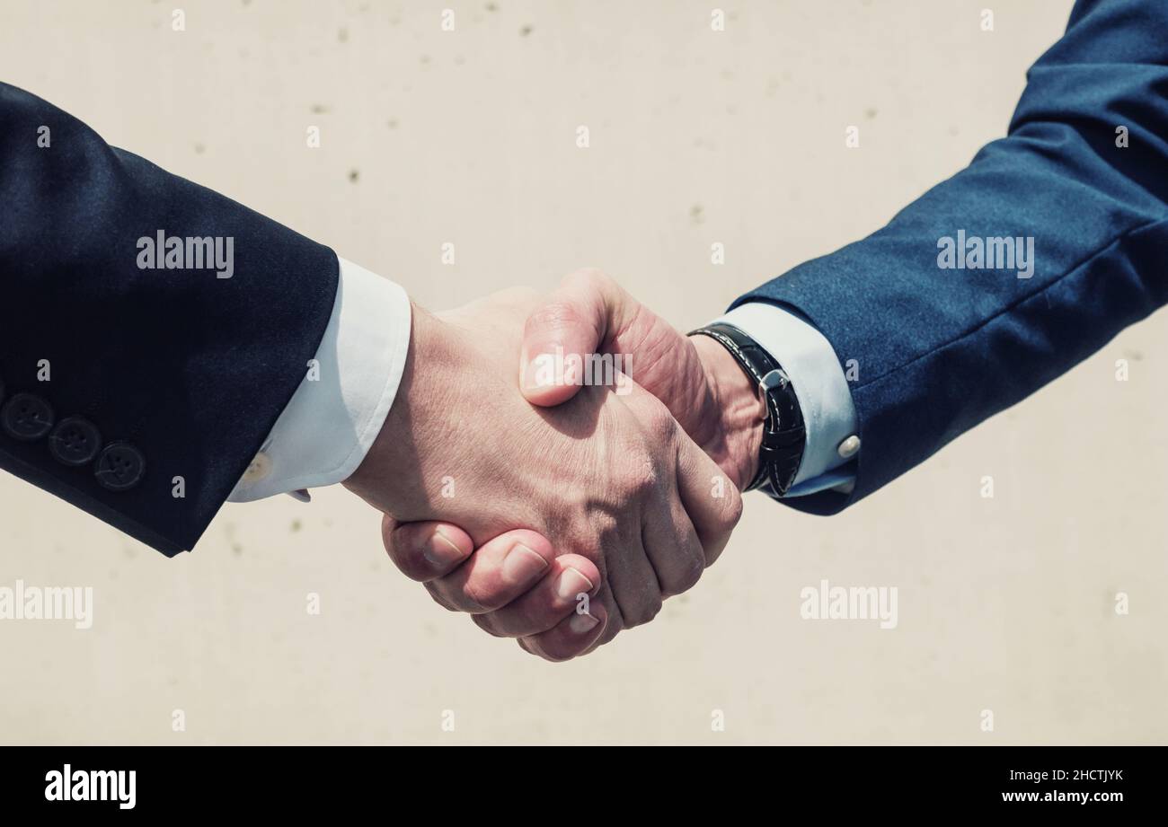 Welcome handshake financial partners hi-res stock photography and ...