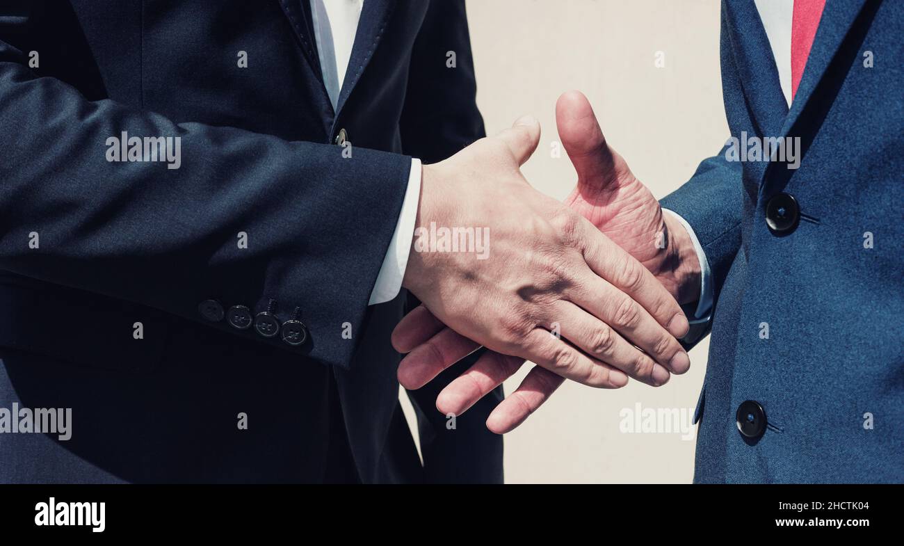 two businessman handshaking process Stock Photo - Alamy
