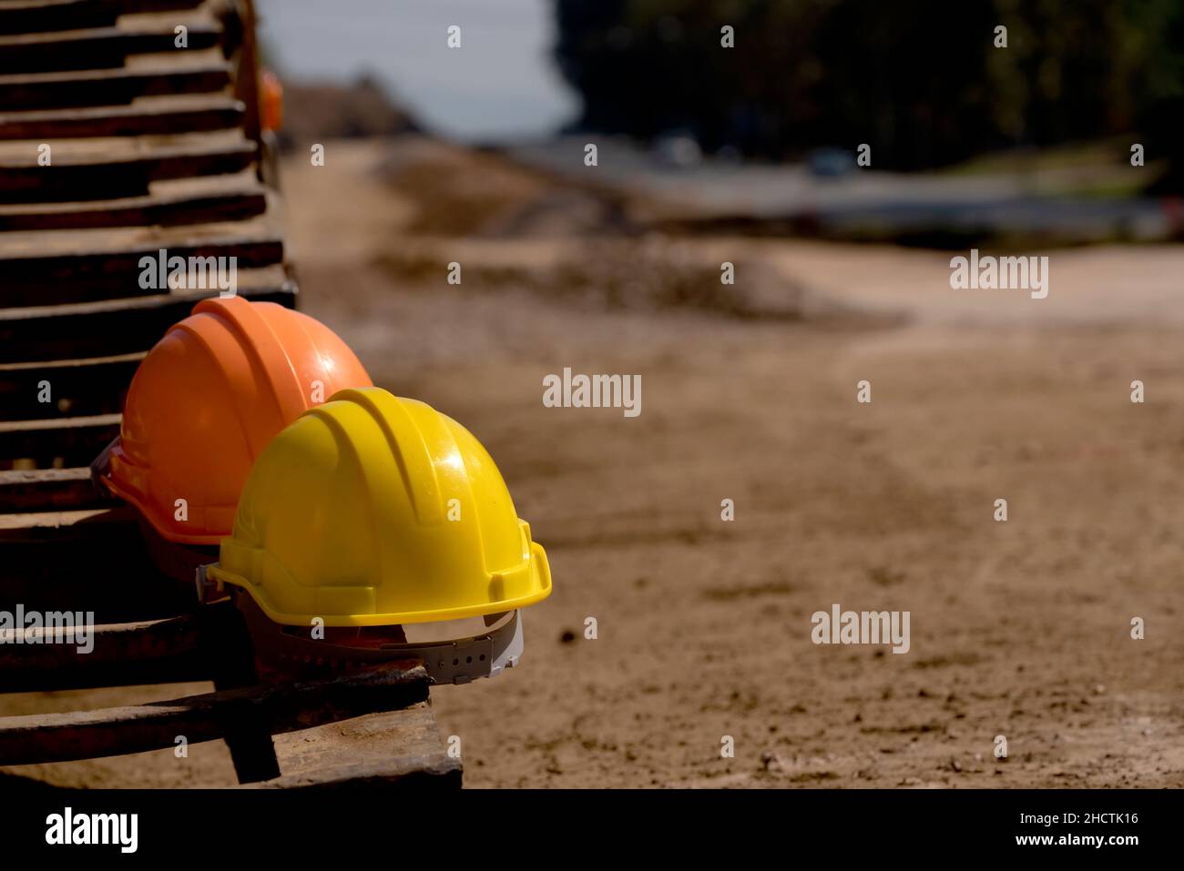 Safety helmet on steel caterpillar tracks of a crane at construction ...