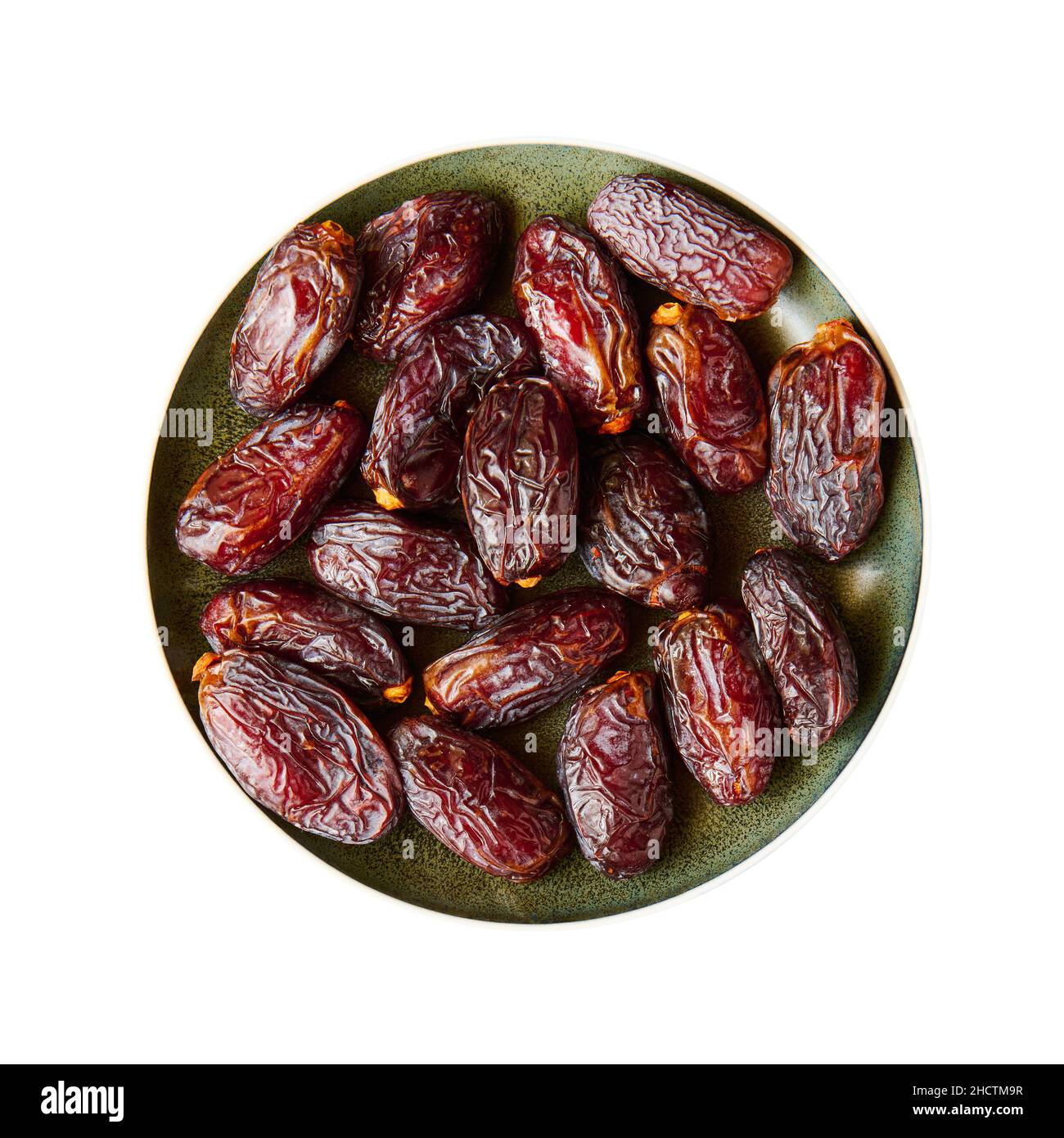 Green plate with dried dates isolated on white background Stock Photo ...