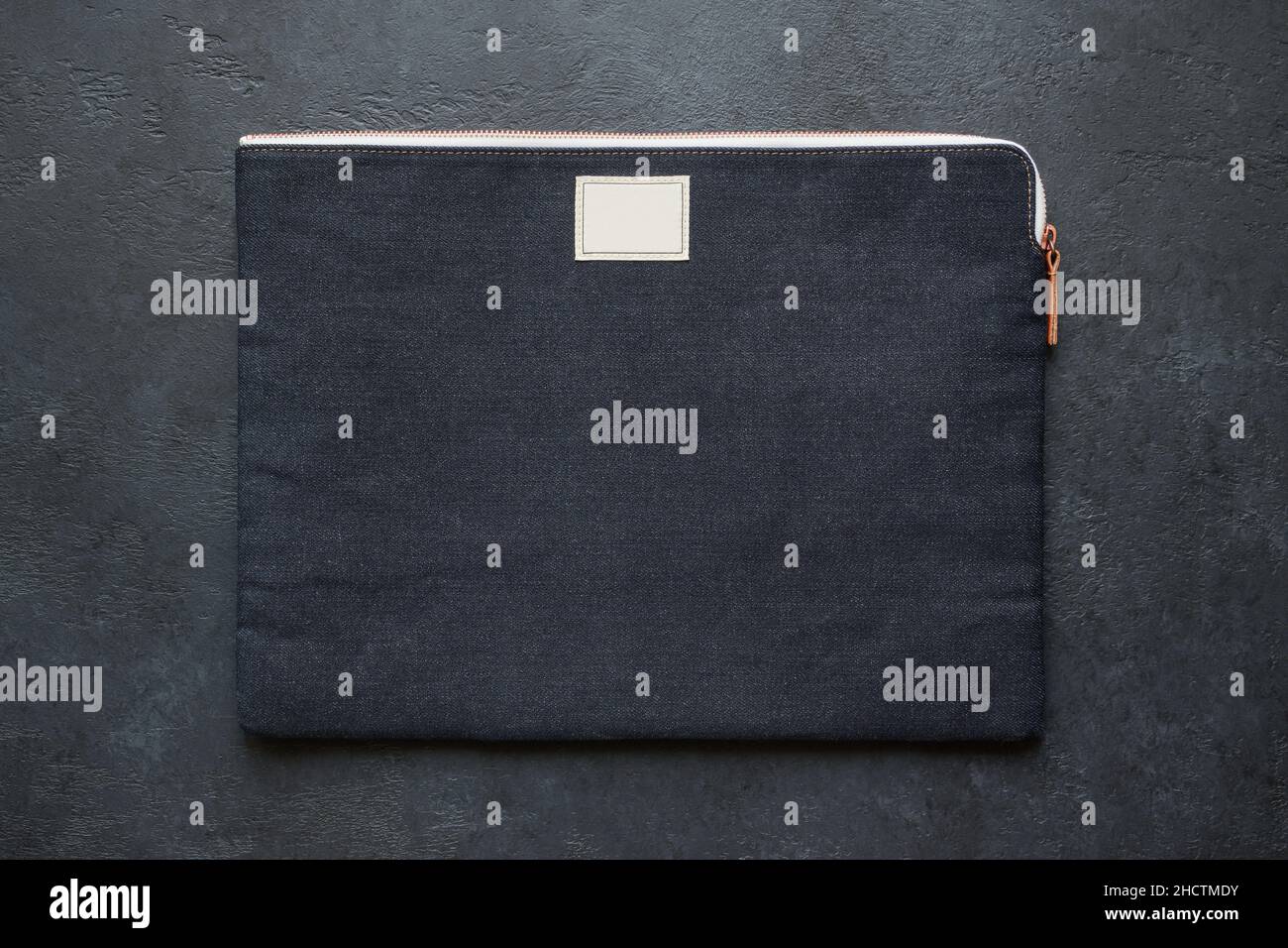 Black denim laptop carrying case on dark background Stock Photo - Alamy