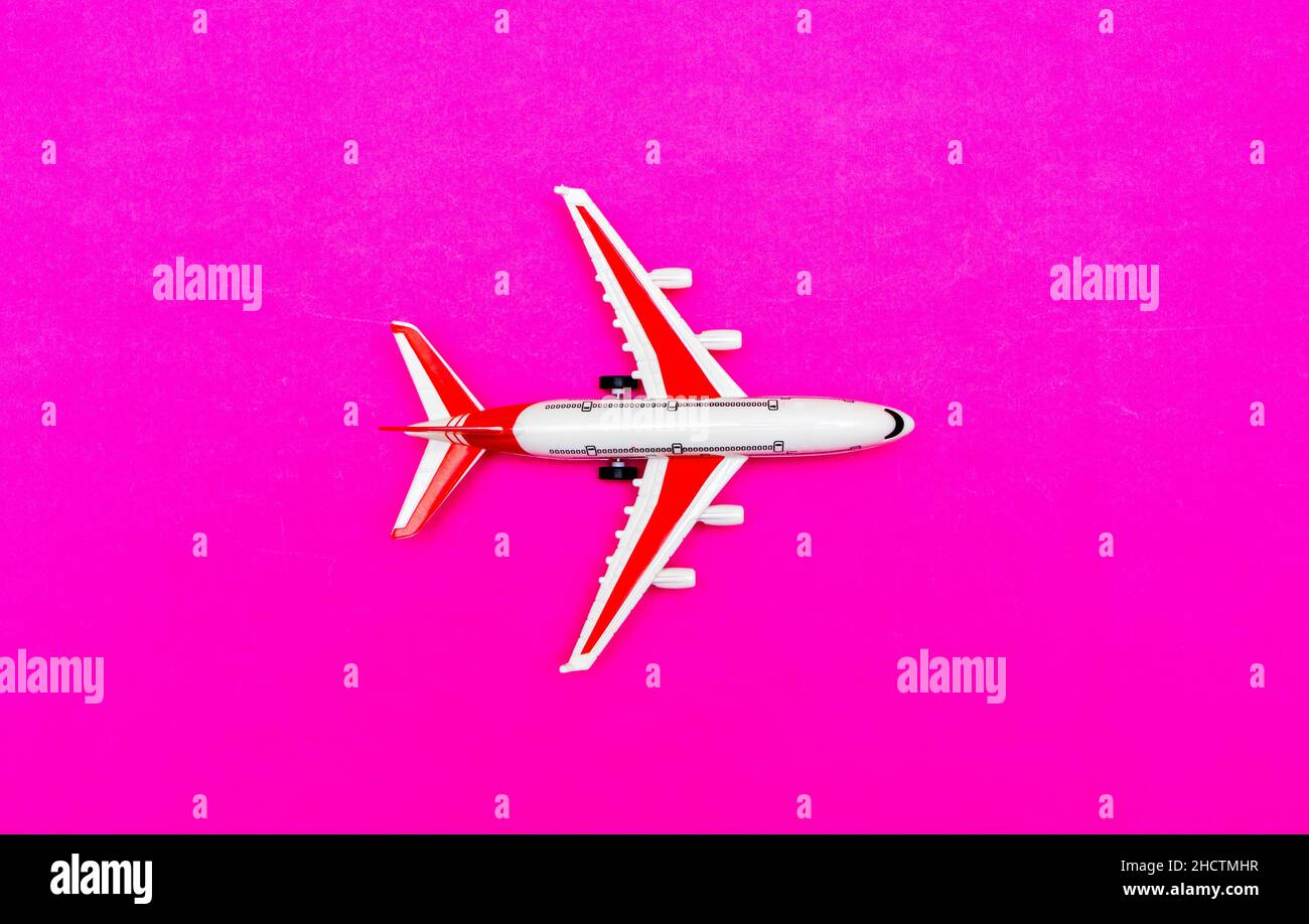 White and red Passenger Model airplane on a red,pink background. Free ...