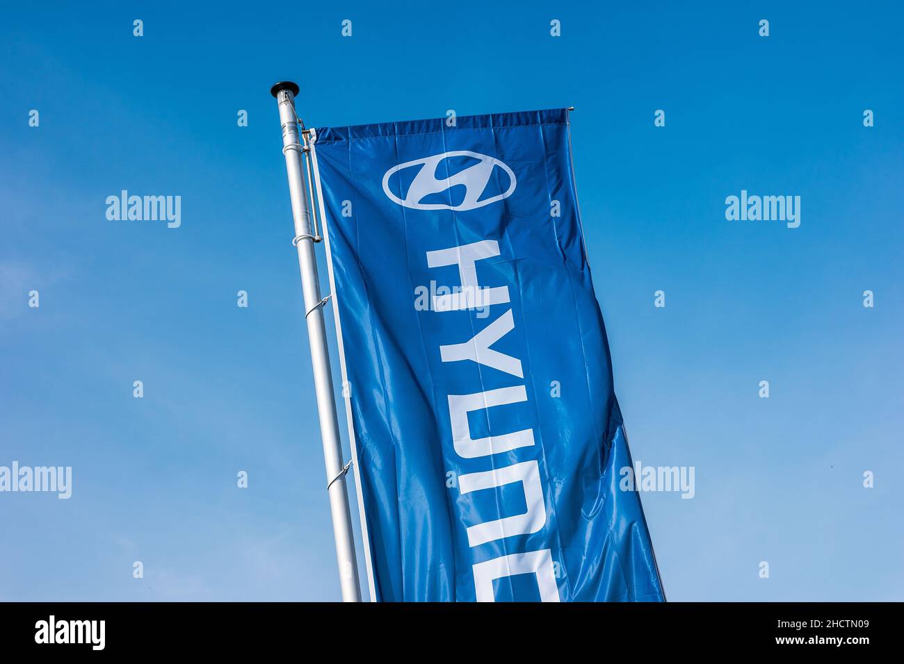 Hyundai logo on a flag. Hyundai Motor Company is a South Korean ...