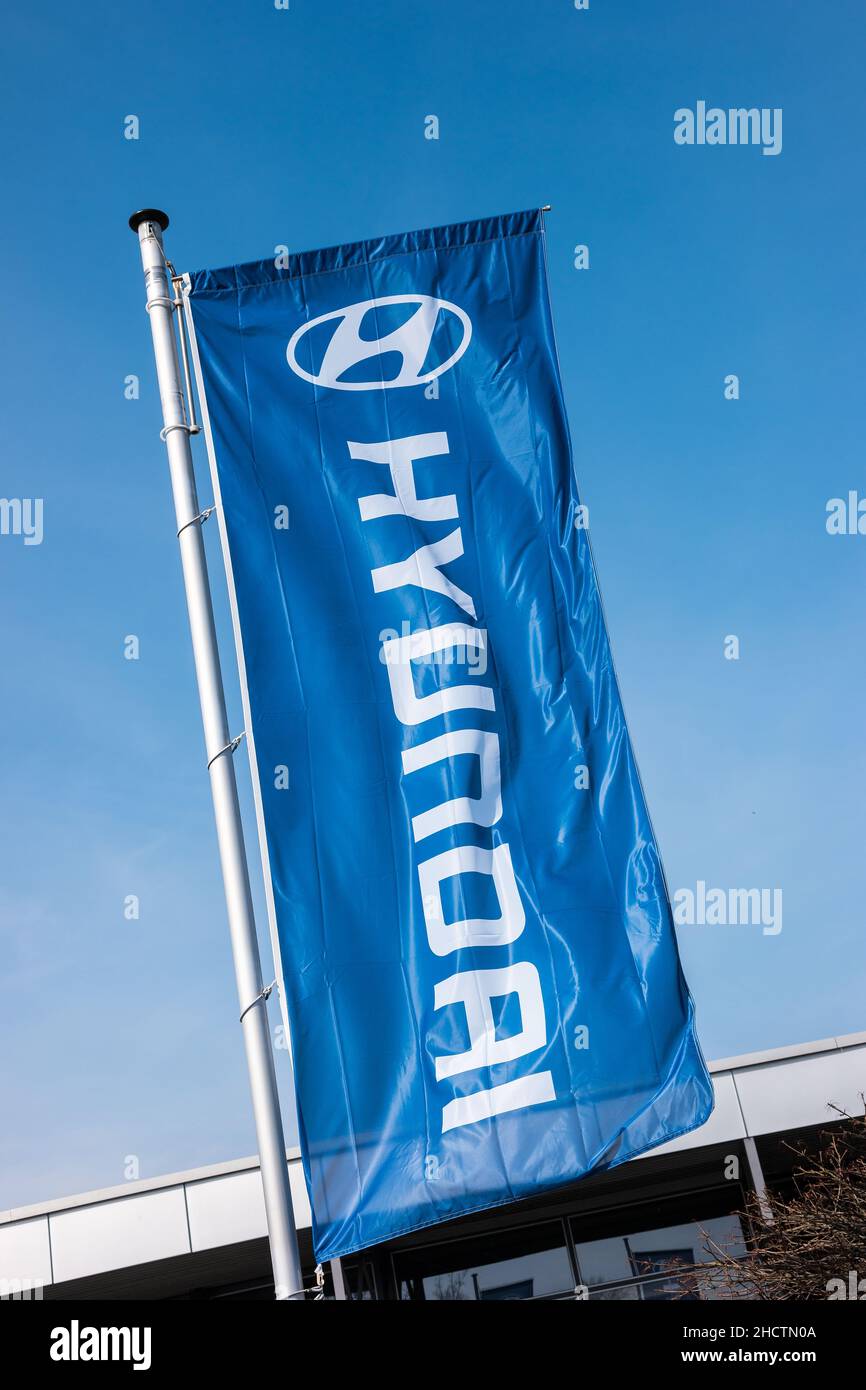Hyundai flag against blue sky. Hyundai Motor Company is a South Korean ...