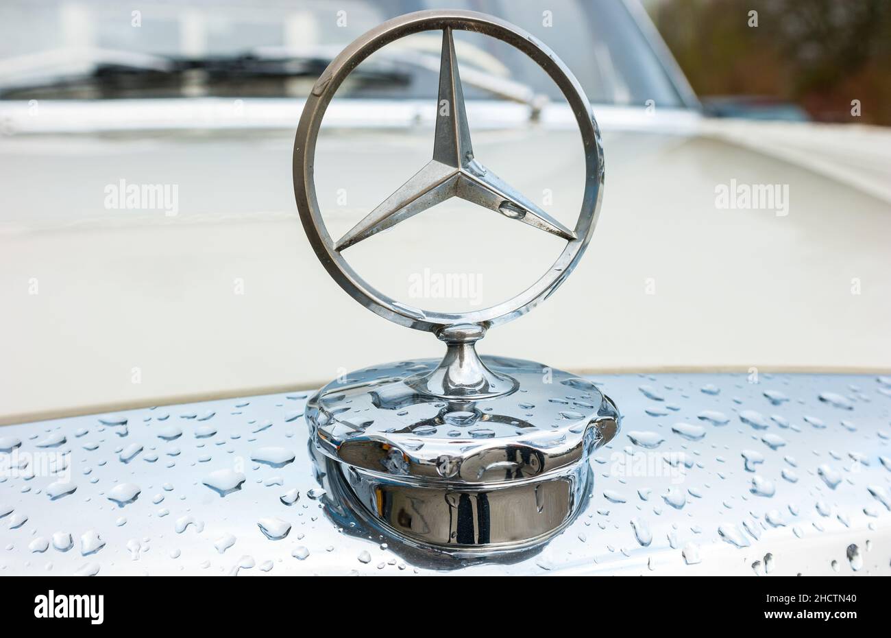 Mercedes Benz logo closeup on a car grill. Mercedes-Benz is a German automobile manufacturer ...