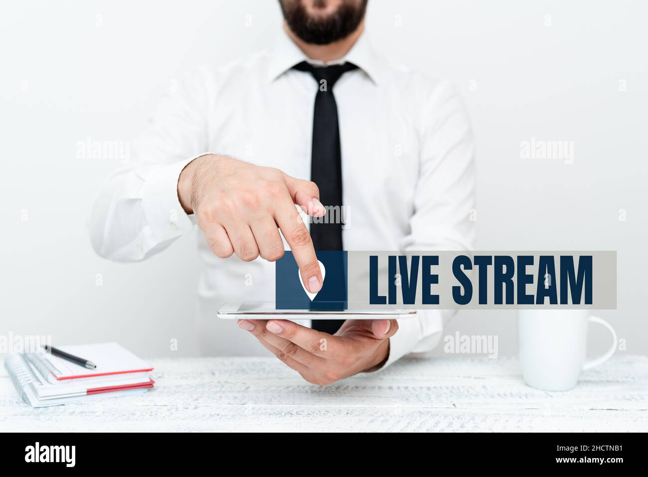 Hand writing sign Live Stream. Word Written on to broadcast a video or ...