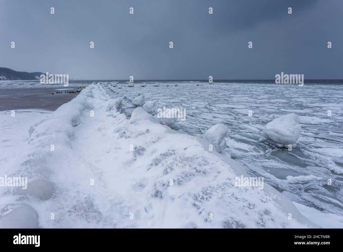 Frozen wooden breakwaters line to the world war II torpedo platform at ...