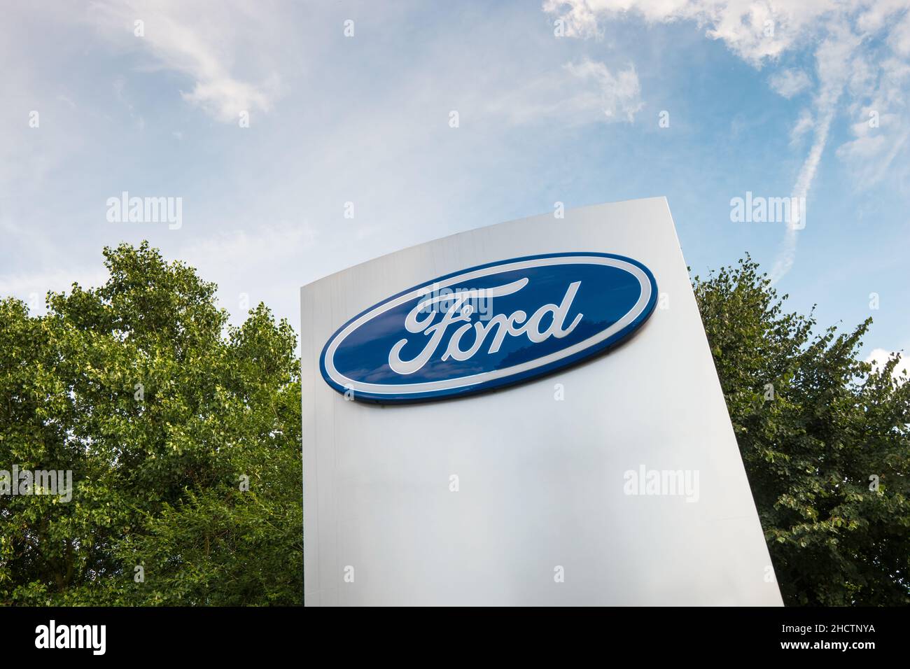Ford logo on a dealership's shield. The Ford Motor Company is an ...