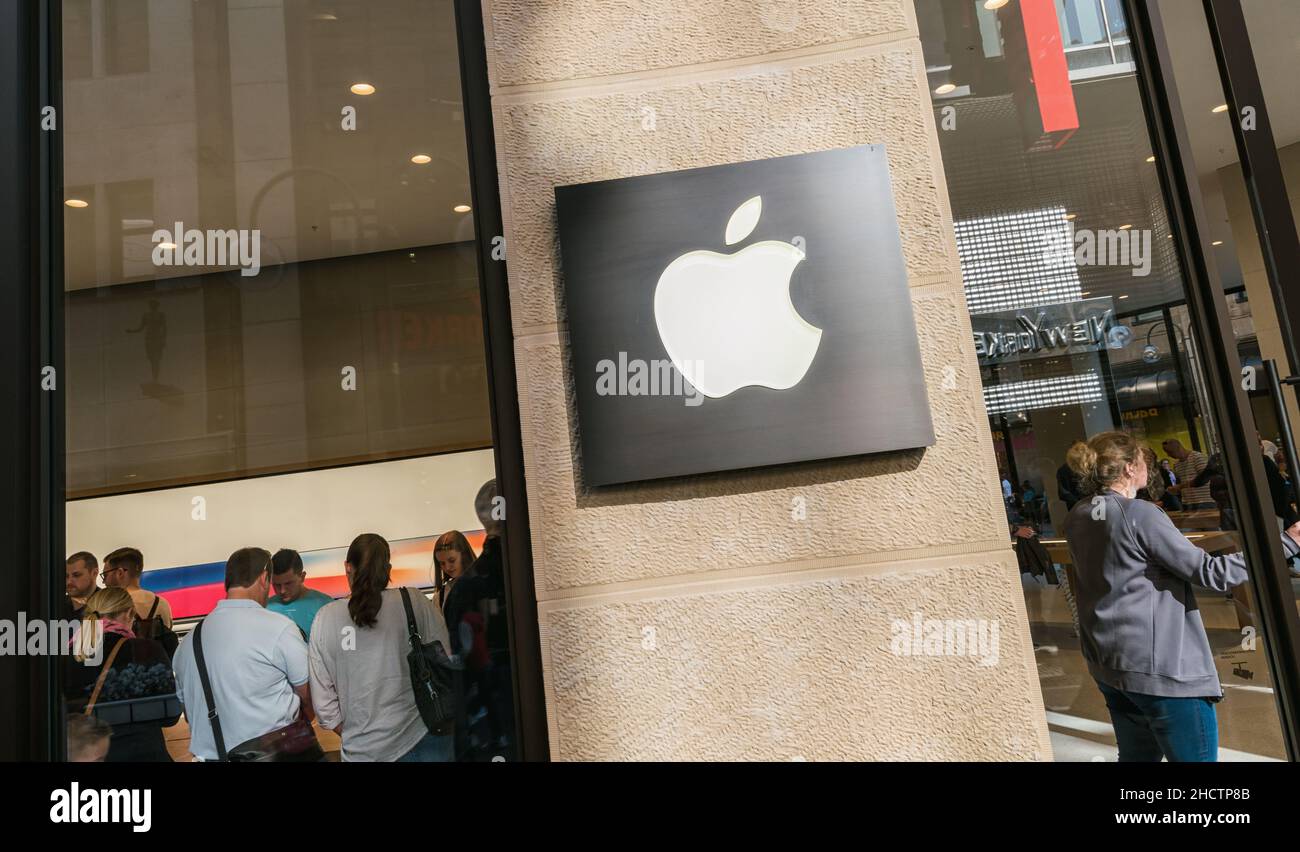 Apple Store brand logo on store front. Apple is the multinational ...