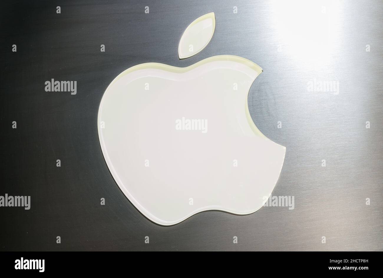 Apple Store brand logo on store front. Apple is the multinational ...