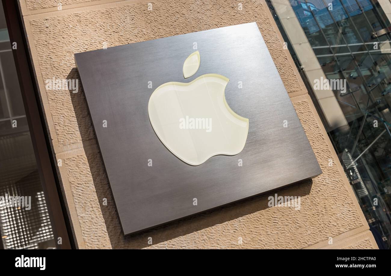 Apple Store brand logo on store front. Apple is the multinational ...
