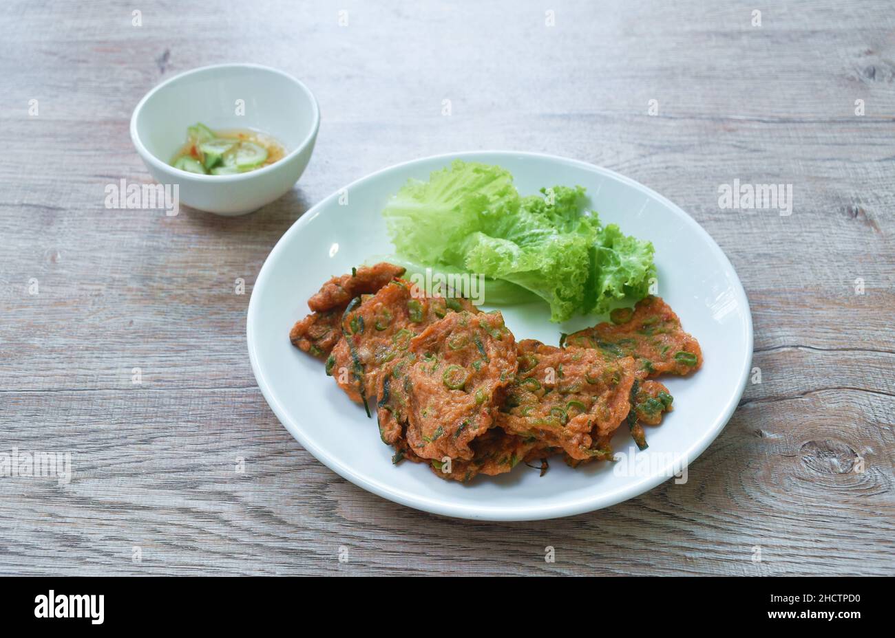fried fish patty on plate dipping sweet chili sauce Stock Photo - Alamy