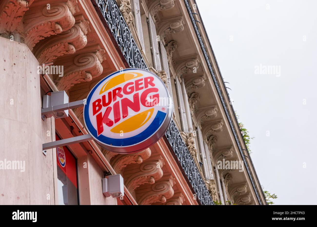 Burger King sign on a building. Burger King, often abbreviated as BK ...