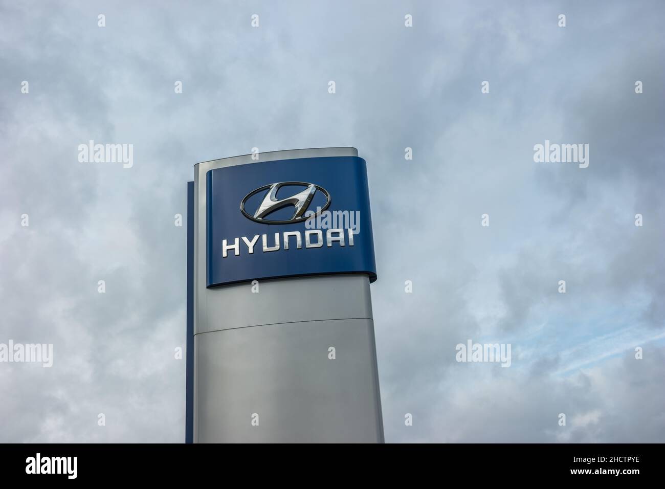 Logotype of Hyundai corporation over cloudy Sky. Hyundai is the South ...