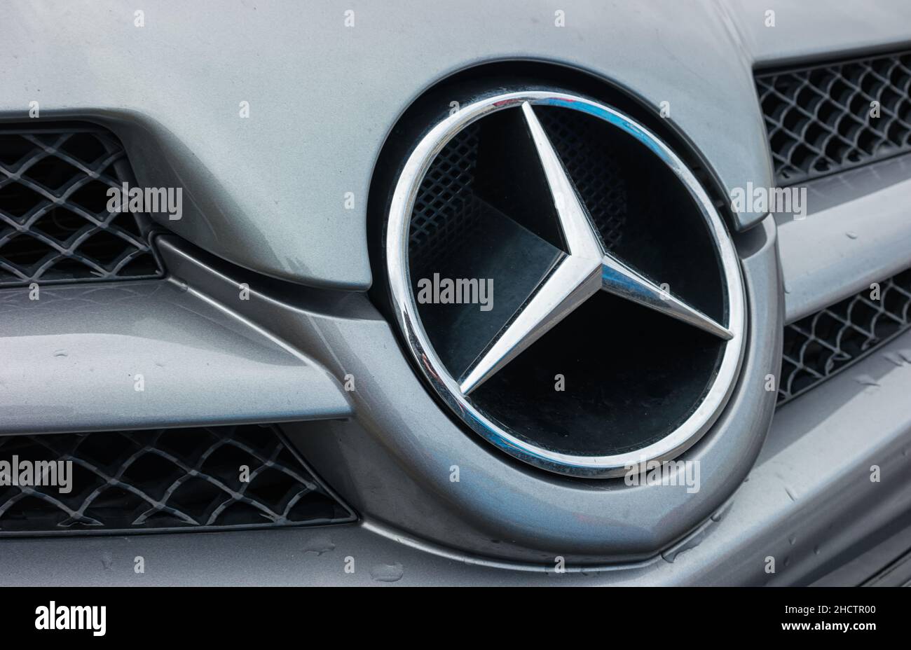 Mercedes Benz logo close up. Mercedes-Benz is a German automobile manufacturer. The brand is ...