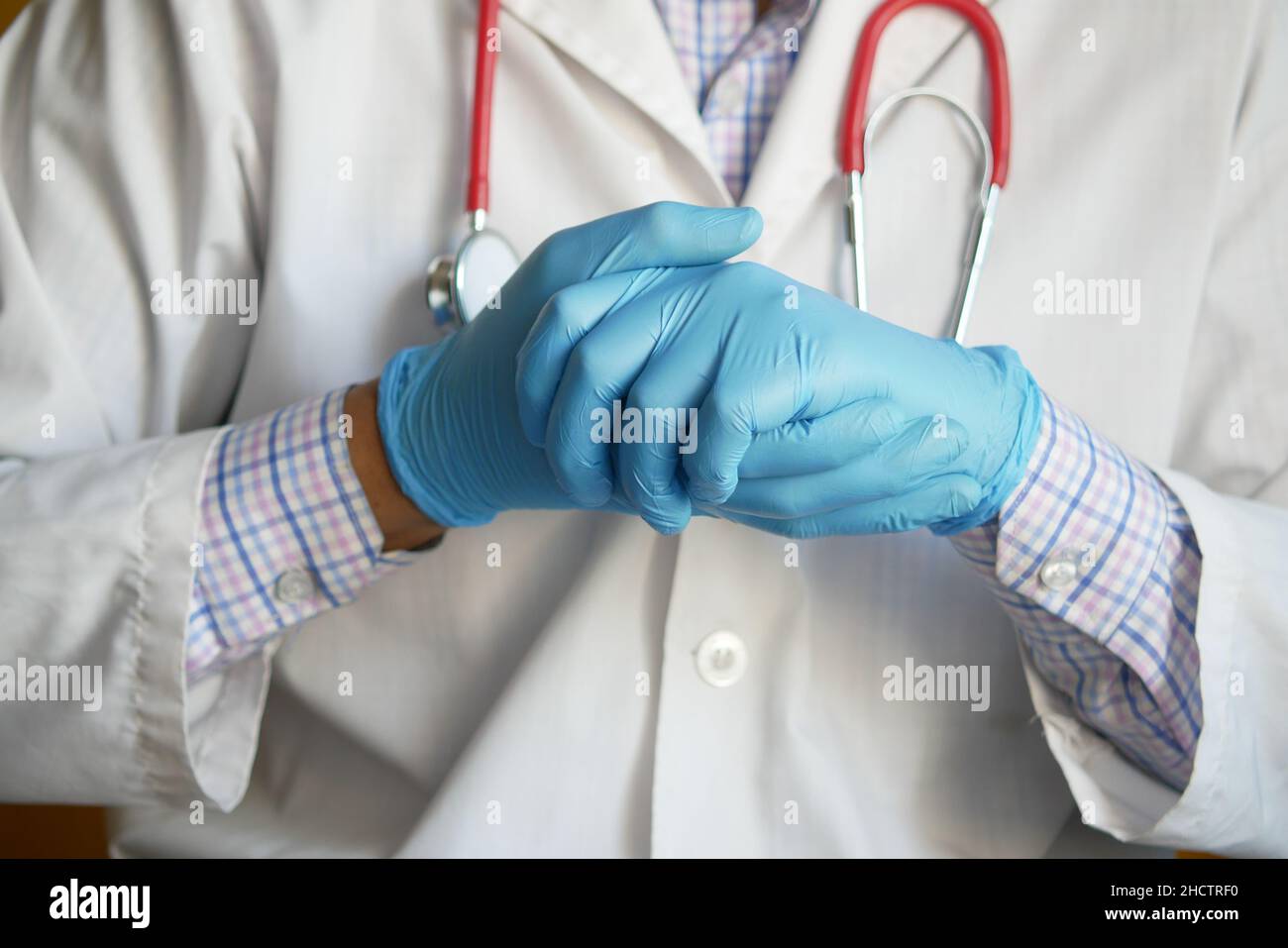 doctor hand with medical gloves showing support sign Stock Photo - Alamy