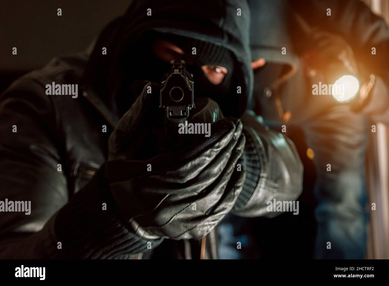 dangerous burglar duo with a Gun in his hand Stock Photo - Alamy