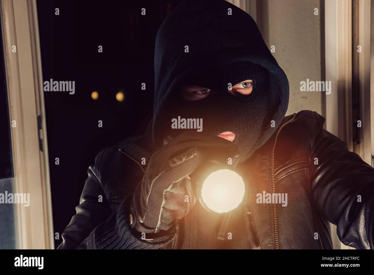 Burglar looking through window hi-res stock photography and images - Alamy