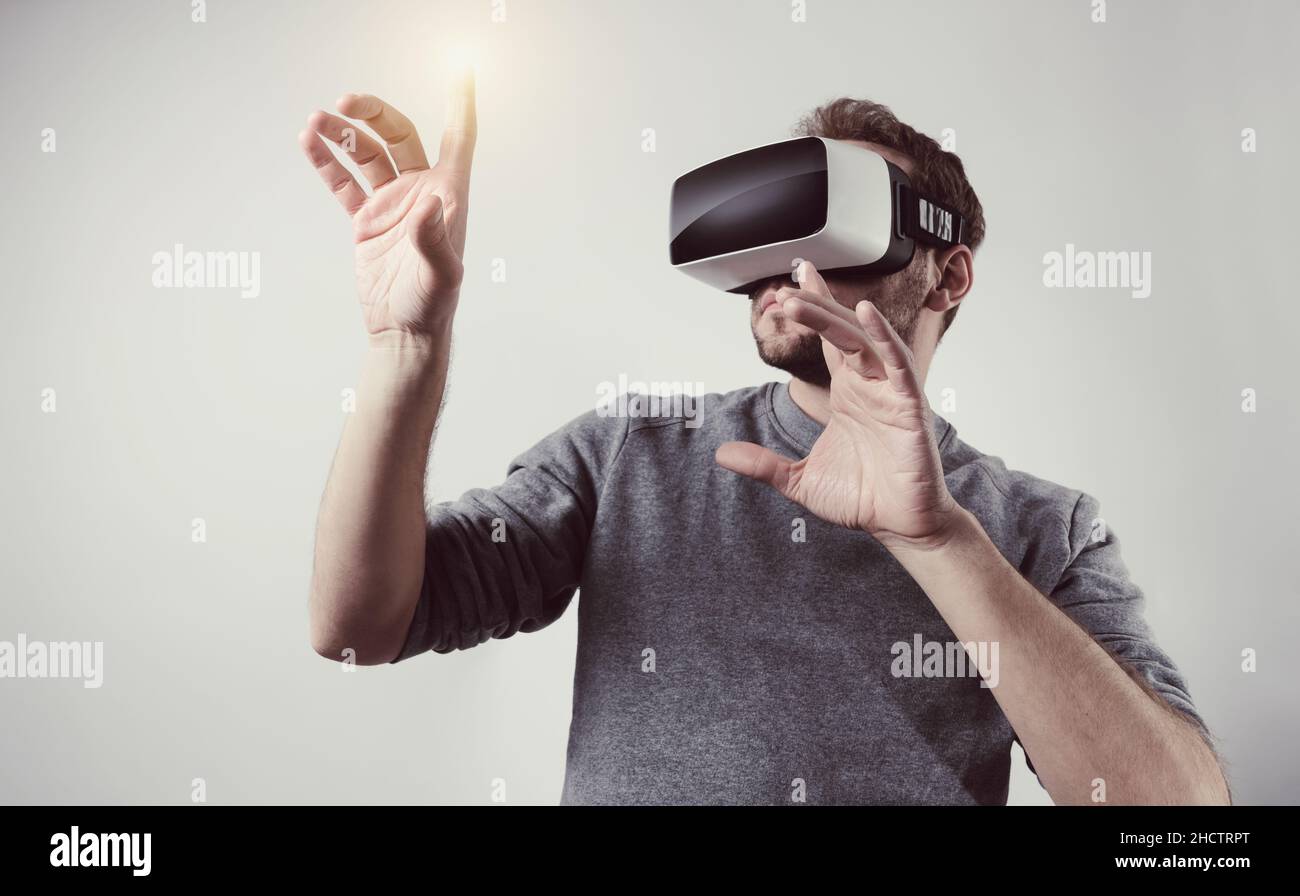 Man wearing virtual reality simulator goggles hi-res stock photography ...