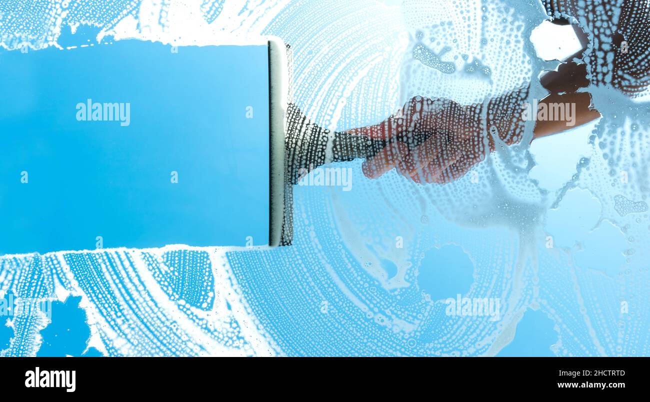 cleaning window with squeegee blue sky Stock Photo - Alamy