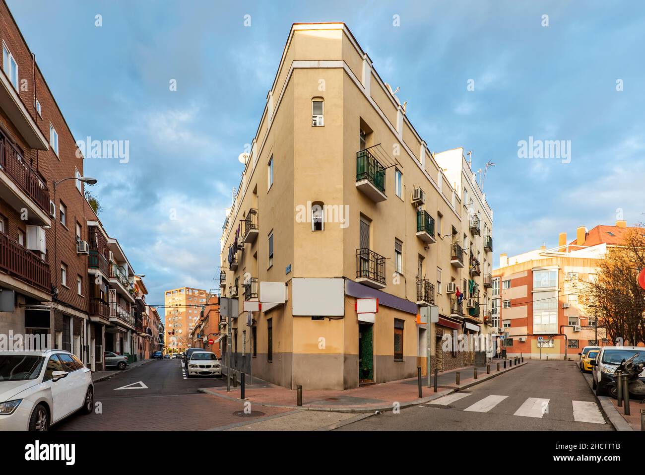 Facade of a building built on the corner of a modest neighborhood in ...