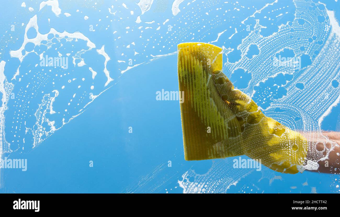 Man washing windows Stock Photo - Alamy