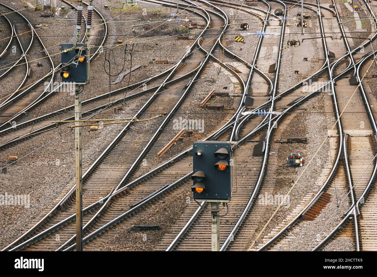 Train tracks with many options for ways forward with multiple switch point and traffic lights ...