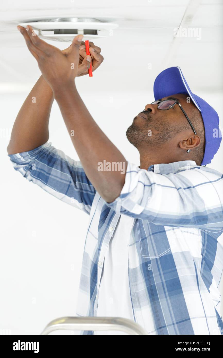 workman or builder marking a spot with pencil Stock Photo - Alamy